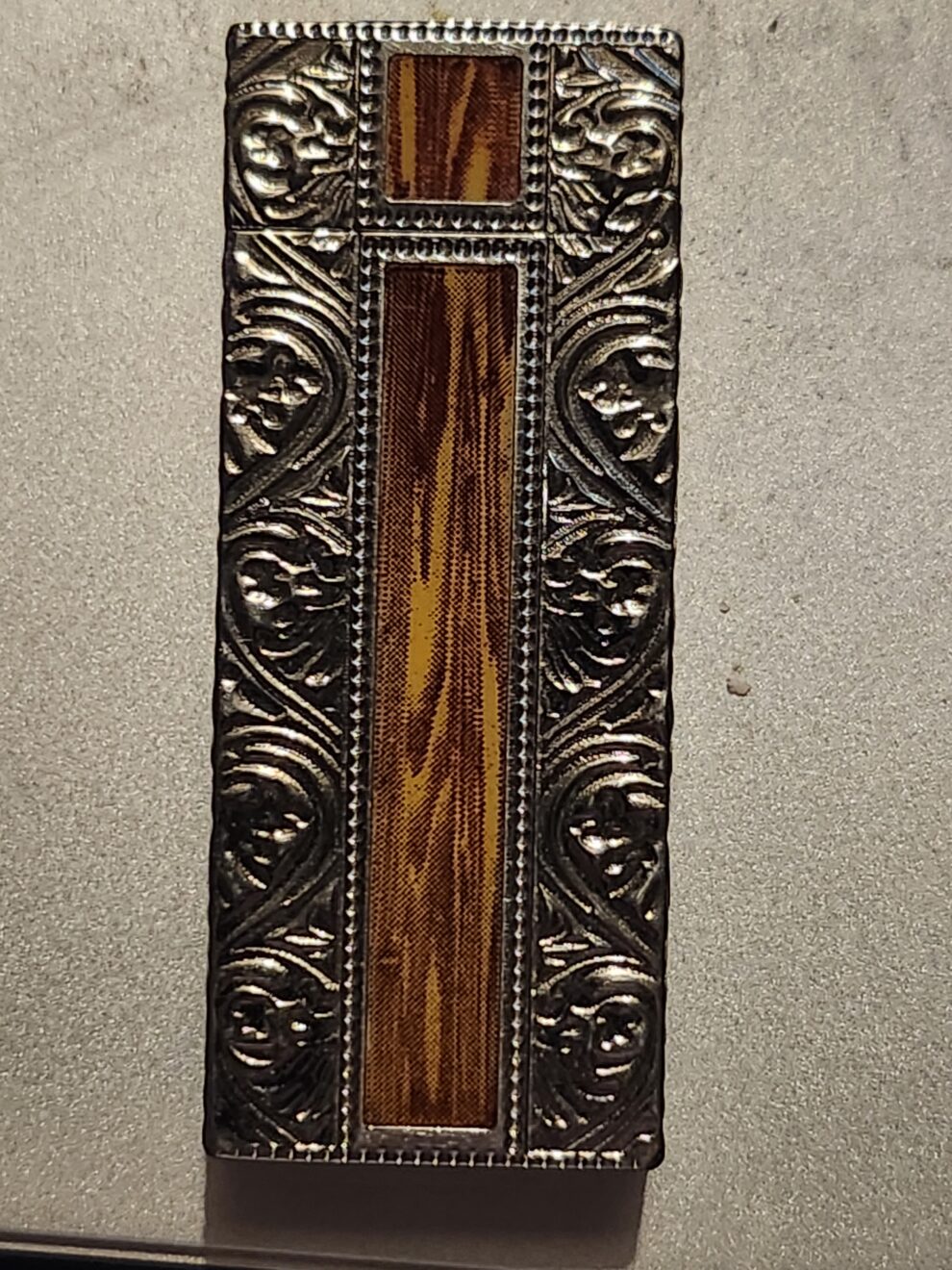 Antique Luxury: S.T. Dupont Silver Carved Lighter's Legacy